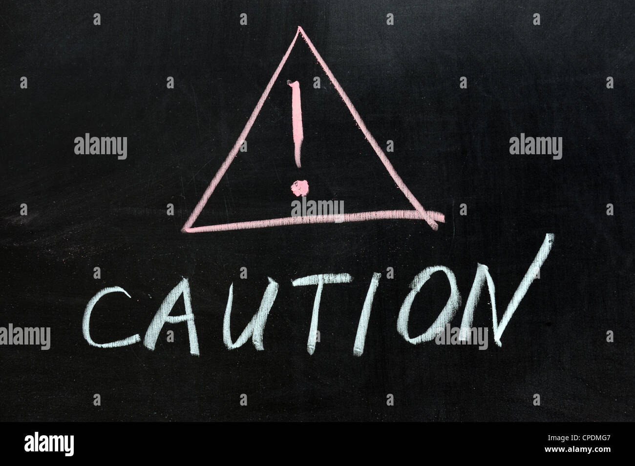 Chalk drawing - Caution sign and text Stock Photo - Alamy