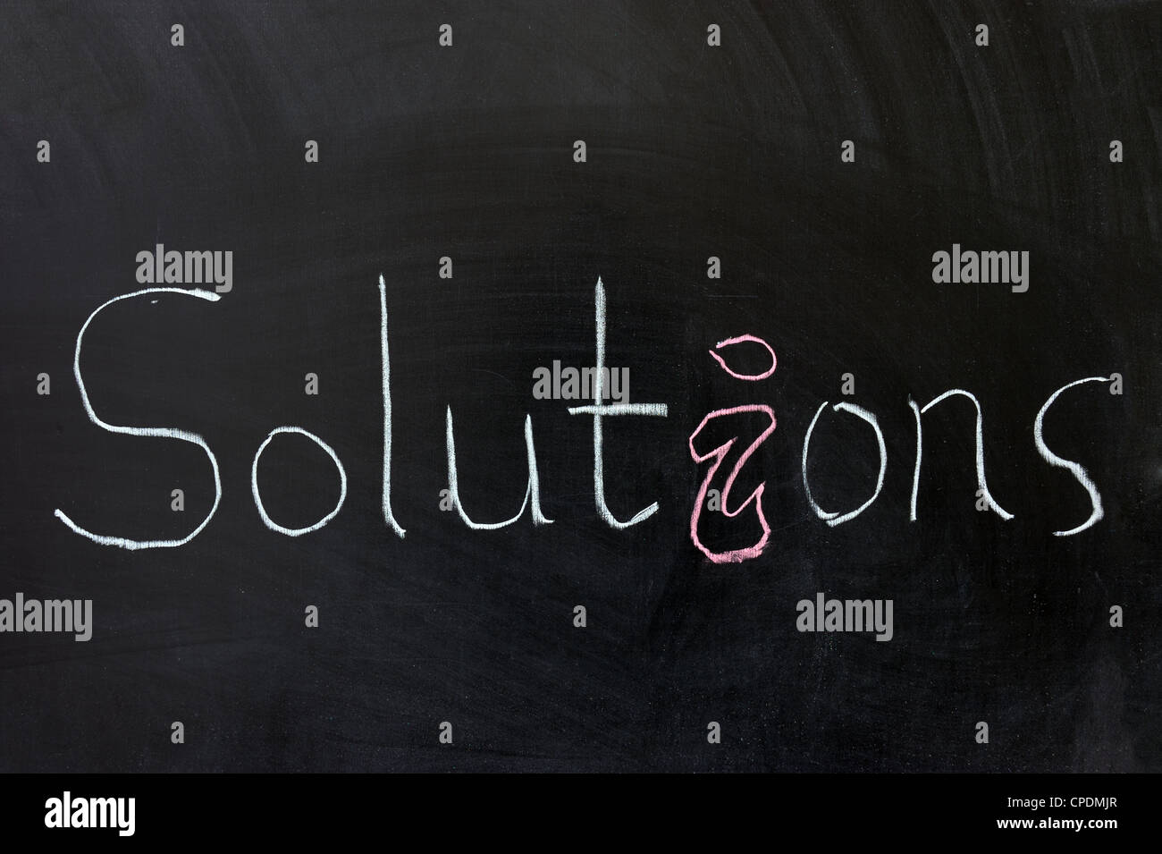 Chalk drawing - Solutions word written on chalkboard Stock Photo - Alamy