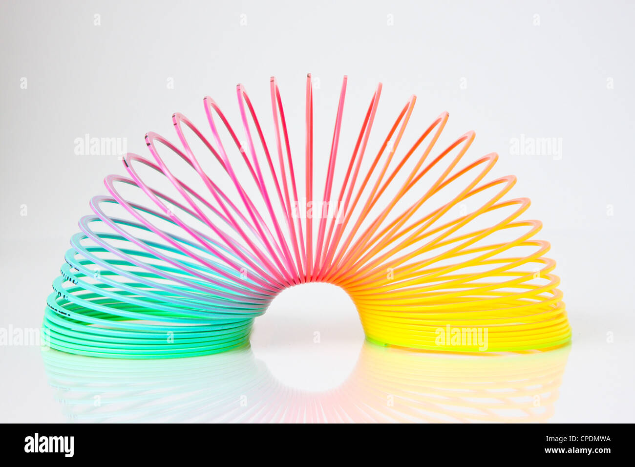 colourful colorful spring toy spiral curve Stock Photo - Alamy