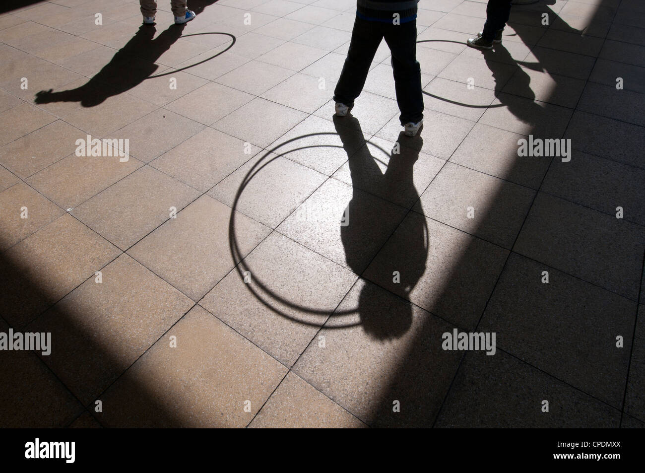 Hackney Central Library. Shadow of children playing with hula hoops ...