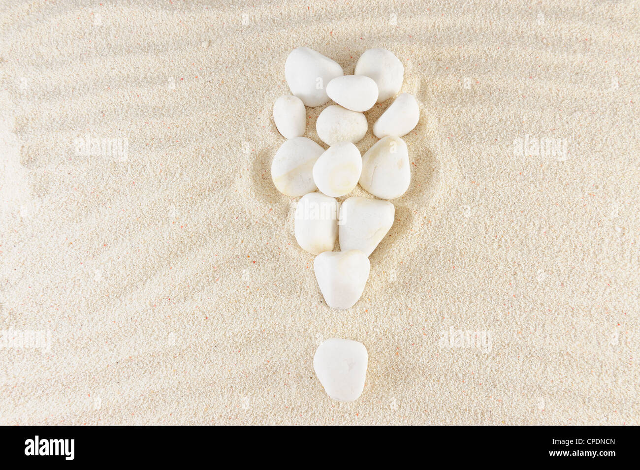 Exclamation mark made of stones with sand background Stock Photo - Alamy