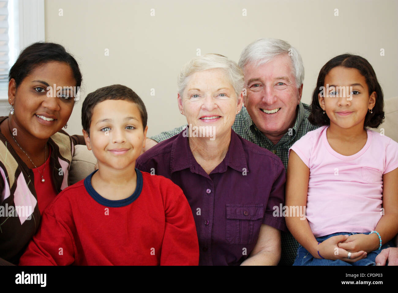 Grandparents together with their family at home Stock Photo - Alamy