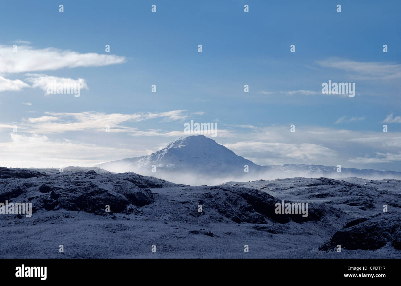 Snow-covered distant summit of the isolated mountain Ben Stack in west ...