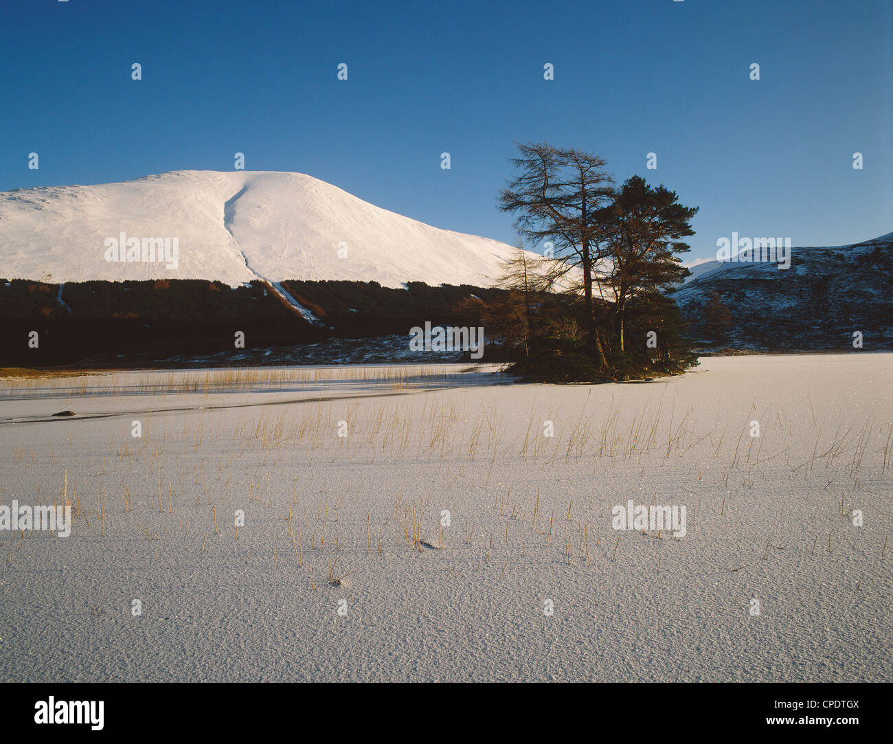 Deep winter over Loch Lundabra below the western end of the Mamore ...