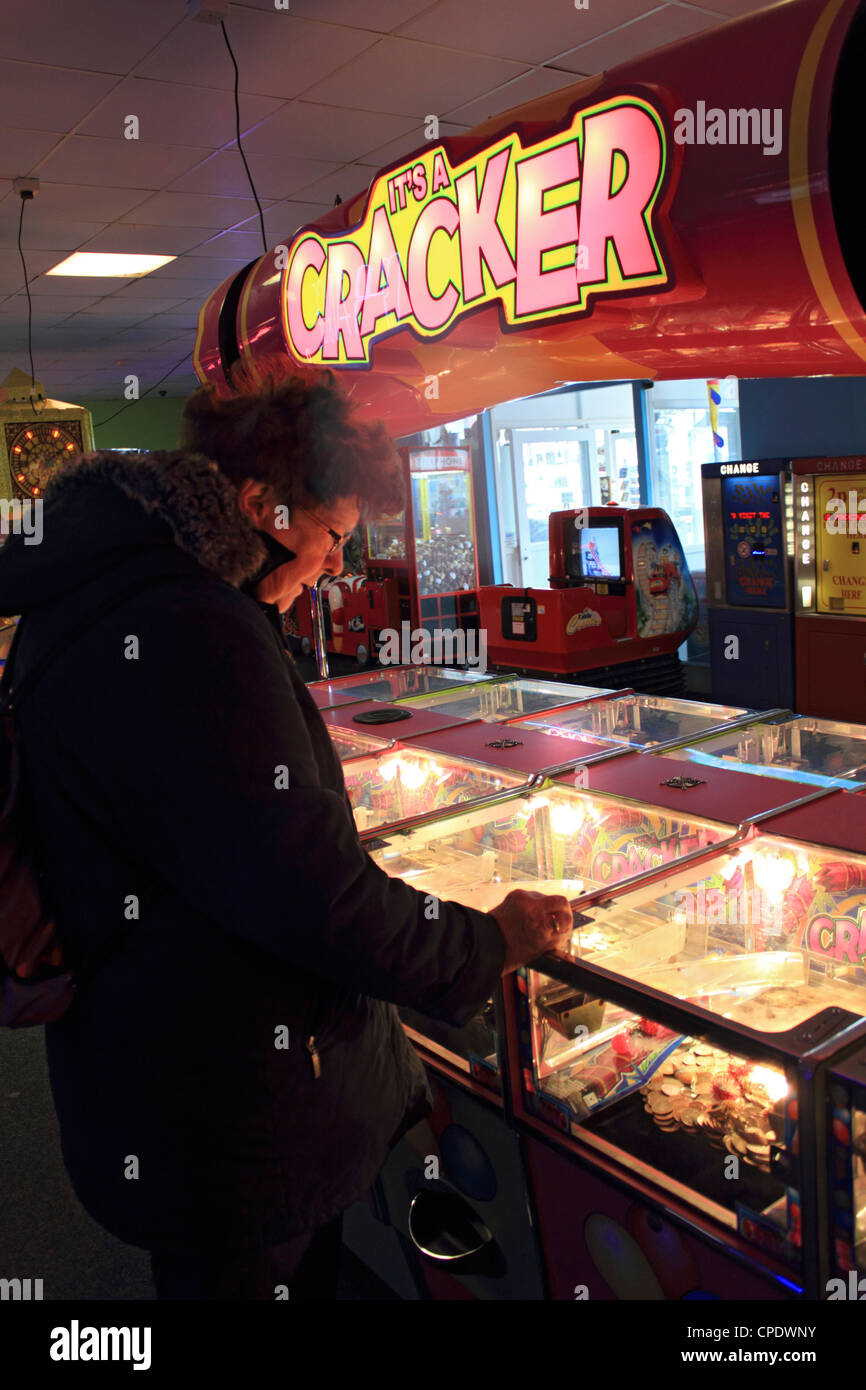 Retired lady plays It's A Cracker - coin drop arcade amusement games on ...