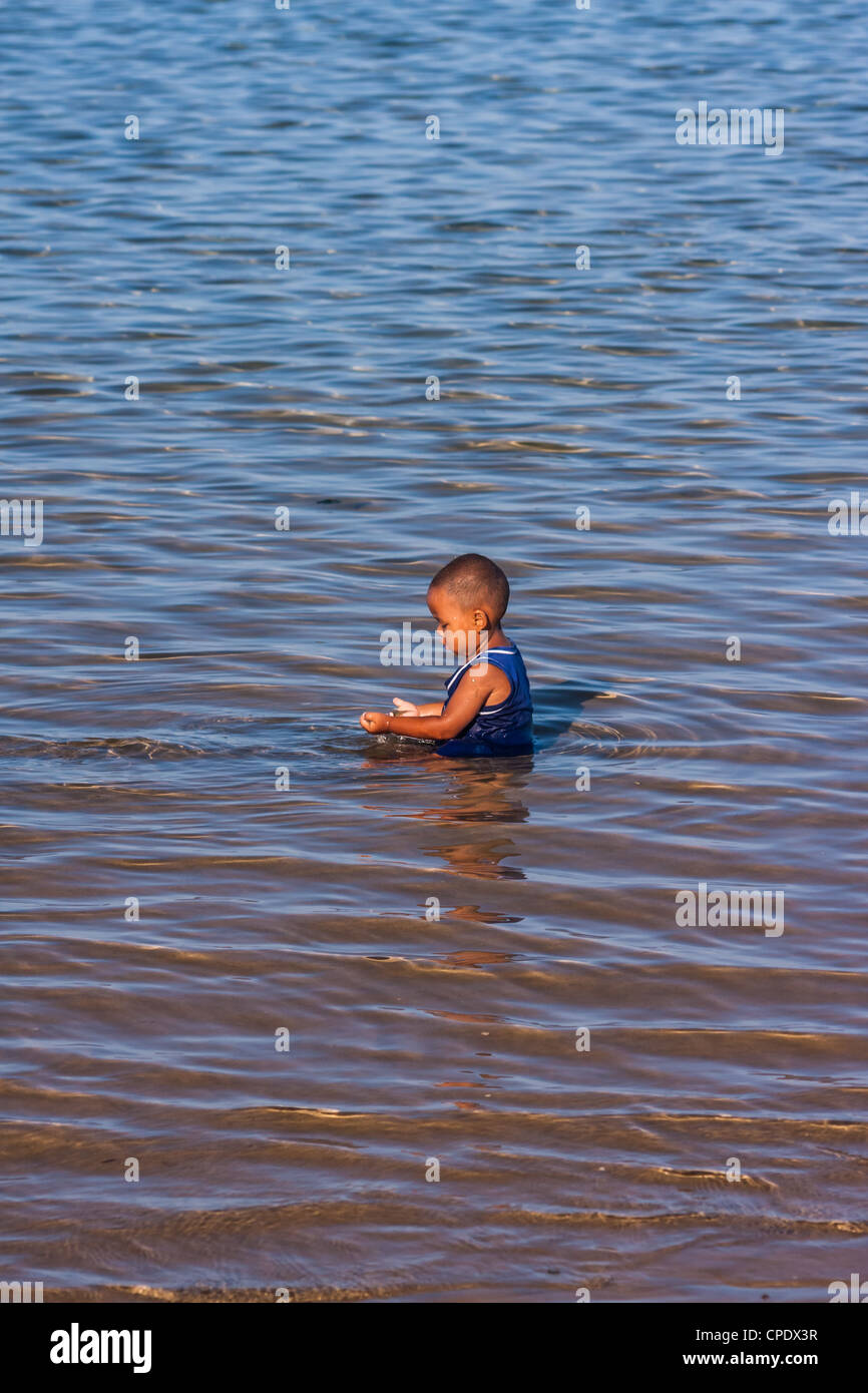 Child bathing in the lagoon of Foulpointe, Madagascar Stock Photo - Alamy