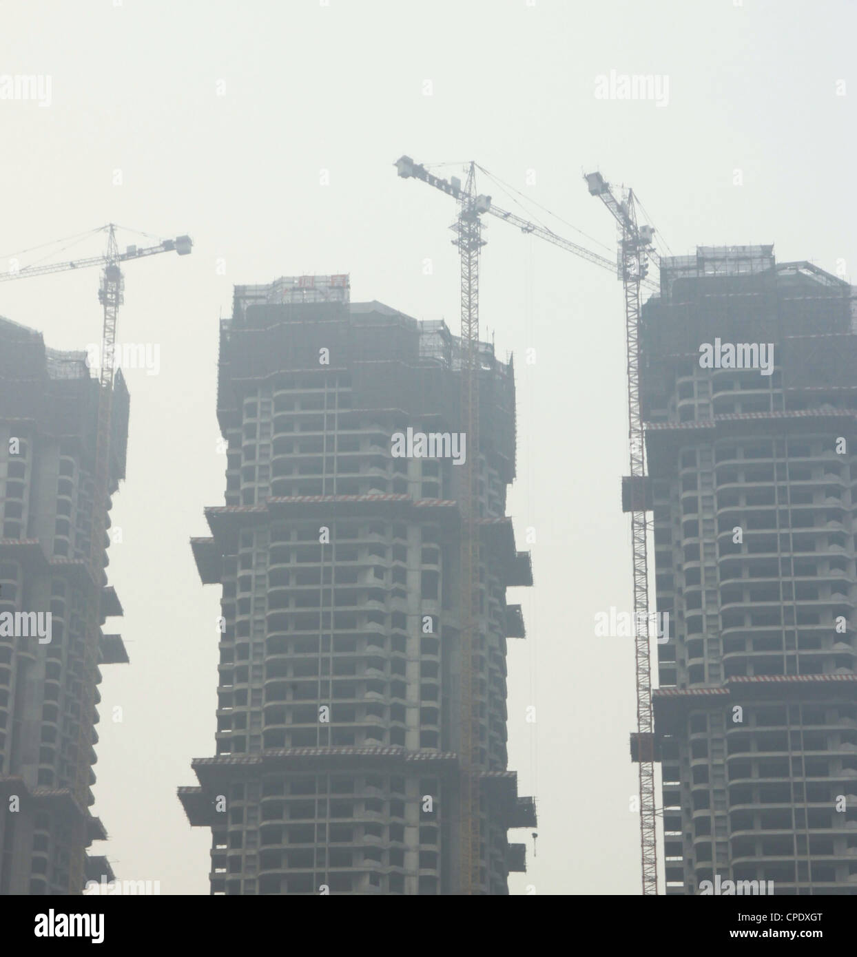 Three buildings under construction in Chongqing, China Stock Photo - Alamy