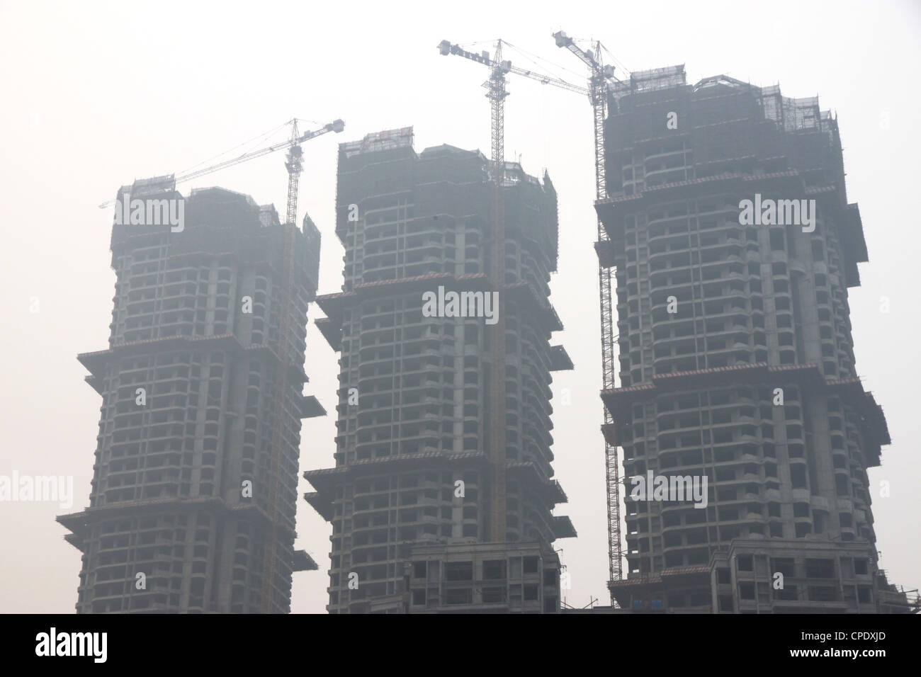 Three buildings under construction in Chongqing, China Stock Photo - Alamy
