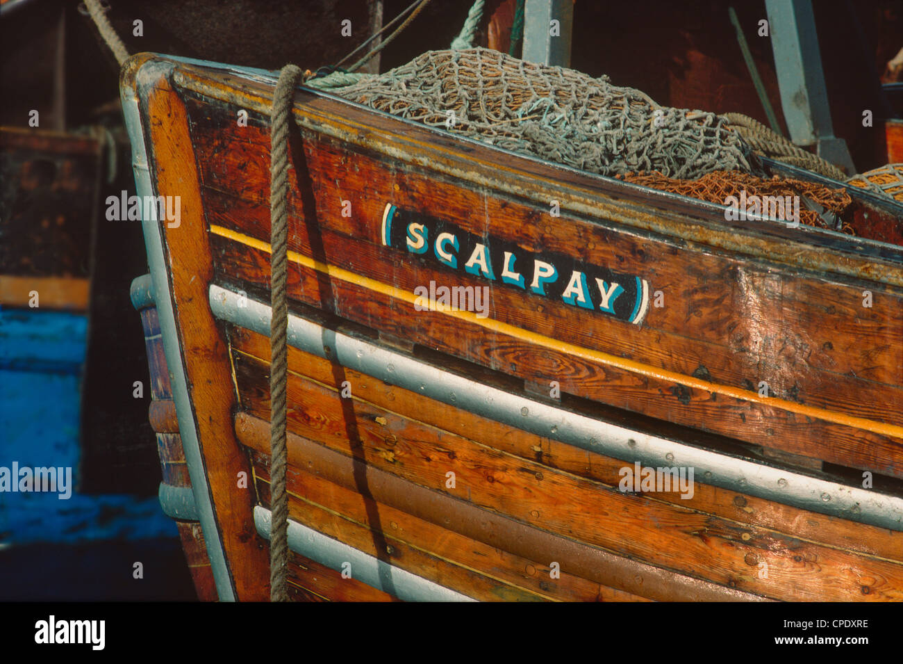 Stern and home port of a traditional wooden fishing-boat in harbour on ...