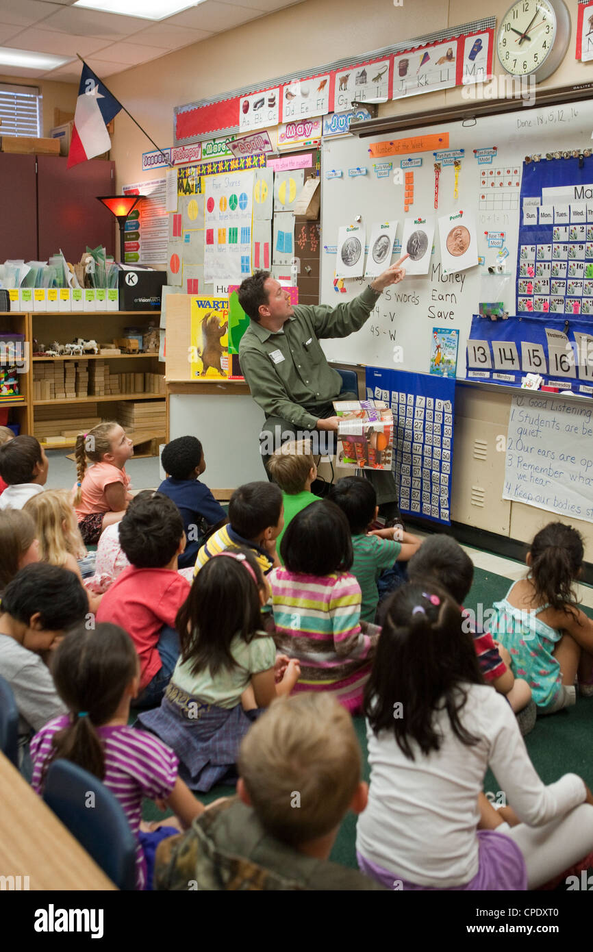Anglo male teacher in training, uses photos of coins while teaching ...