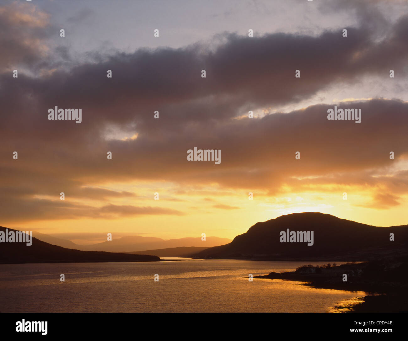 Winter sunset over the Kyle of Scalpay with Scalpay on the left and ...