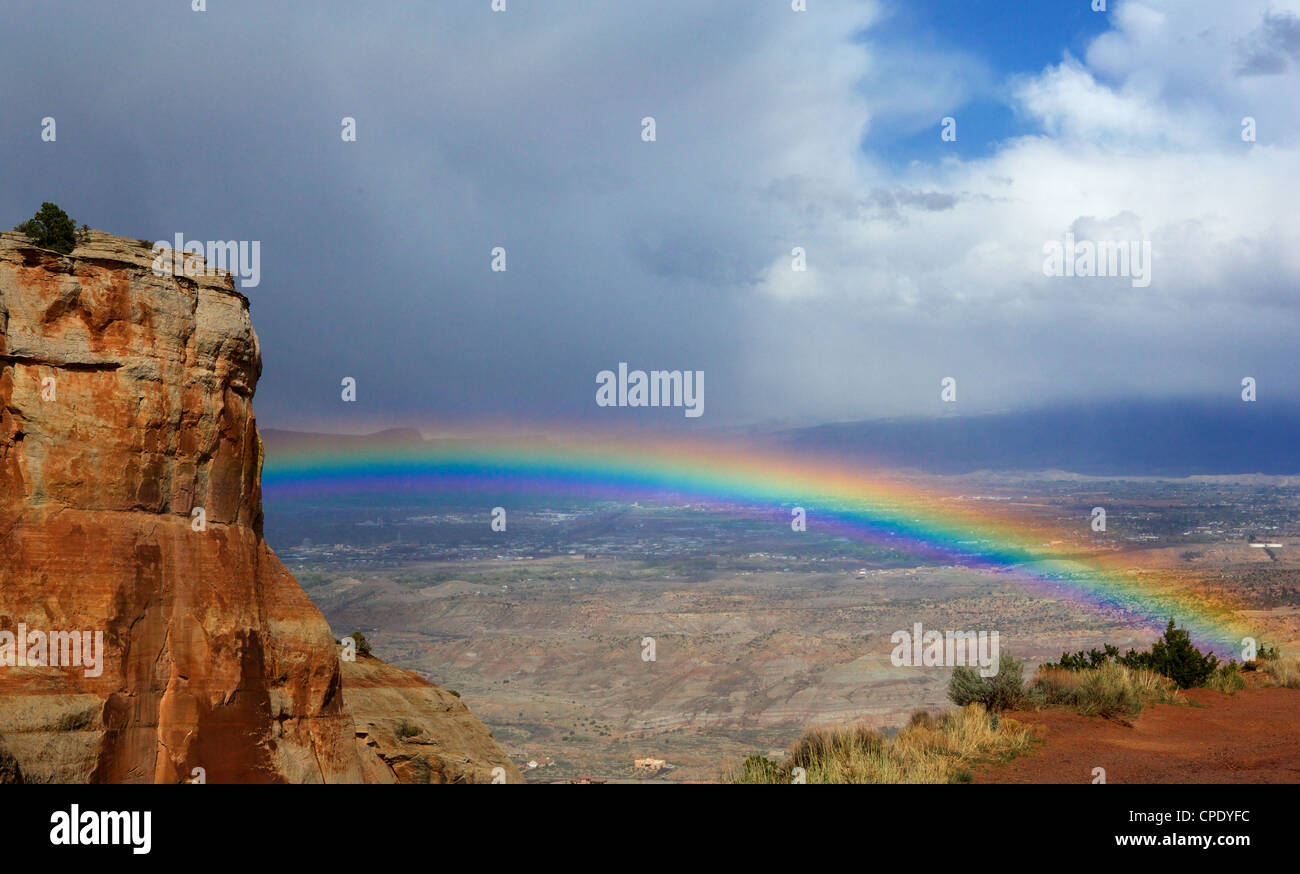 Bright rainbow over Grand Junction Colorado from National Monument Park ...