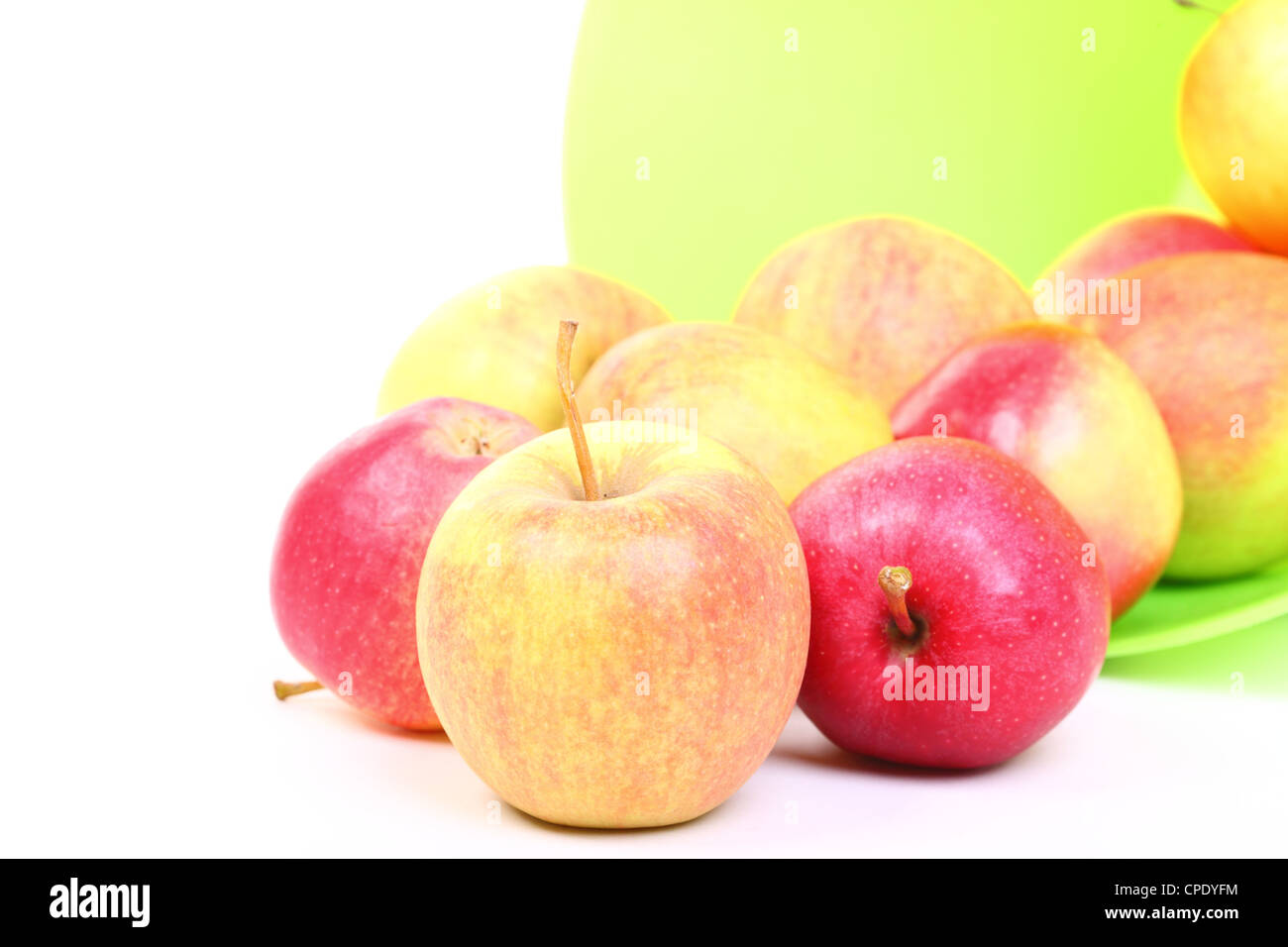 Fresh yellow, red apples in basket isolated over white background Stock ...