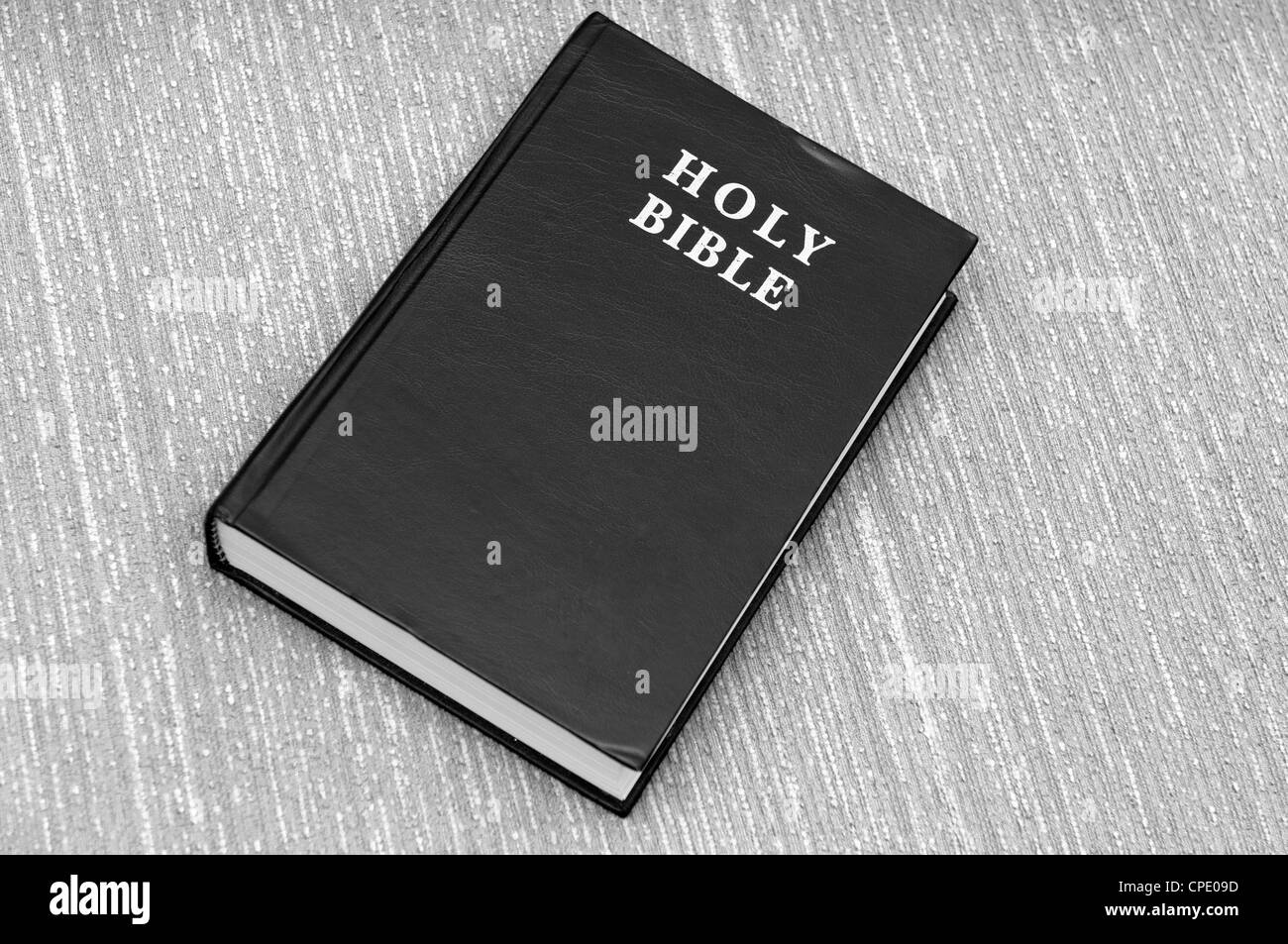 An old bible isolated on red textured background Stock Photo - Alamy