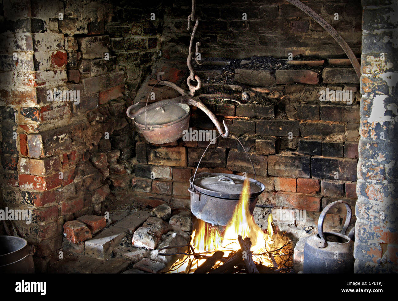 Old cookware in brick fire place Stock Photo - Alamy
