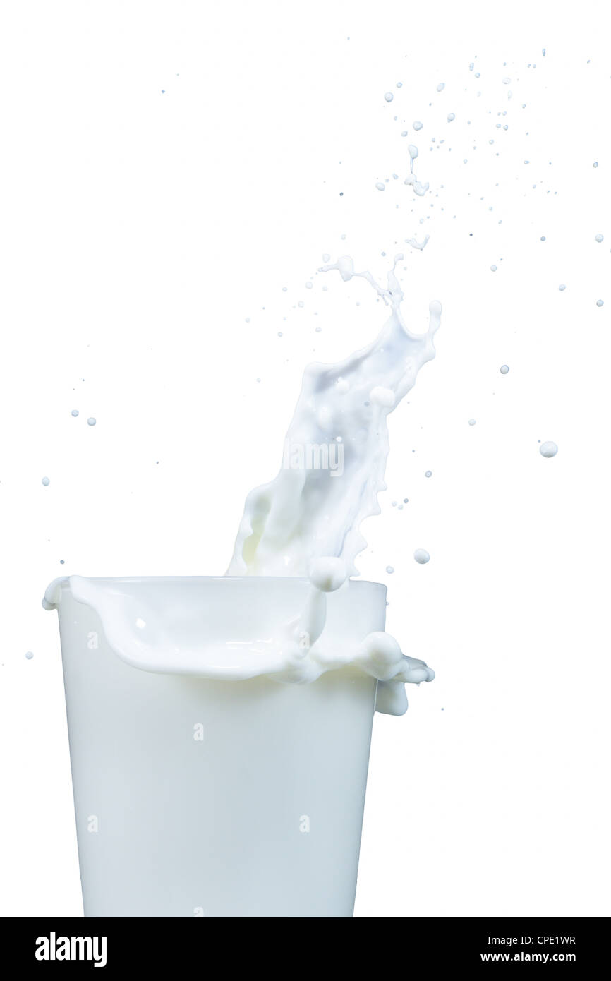 milk splashing from the glass Stock Photo - Alamy