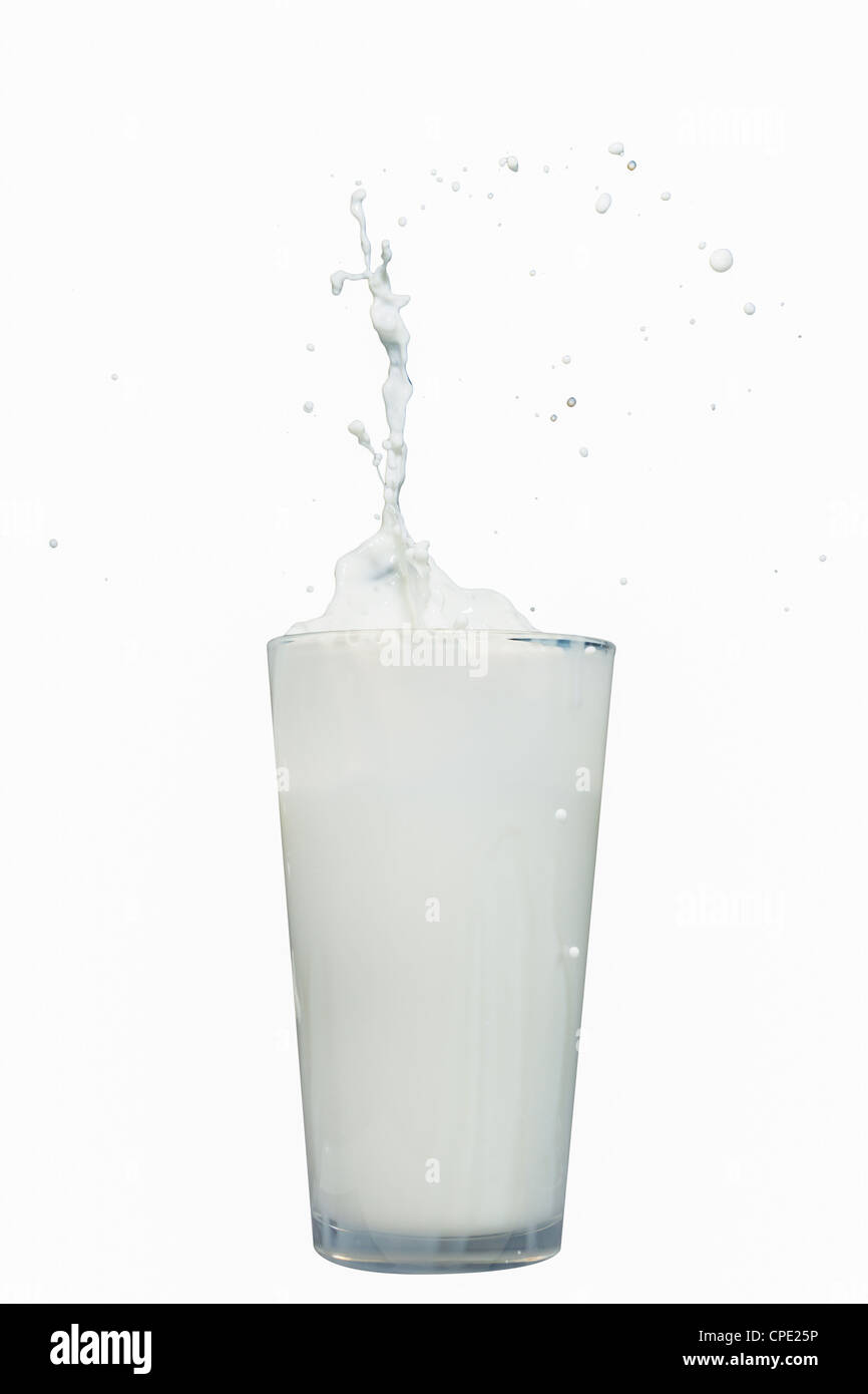 Pouring glass milk from glass Cut Out Stock Images & Pictures - Alamy