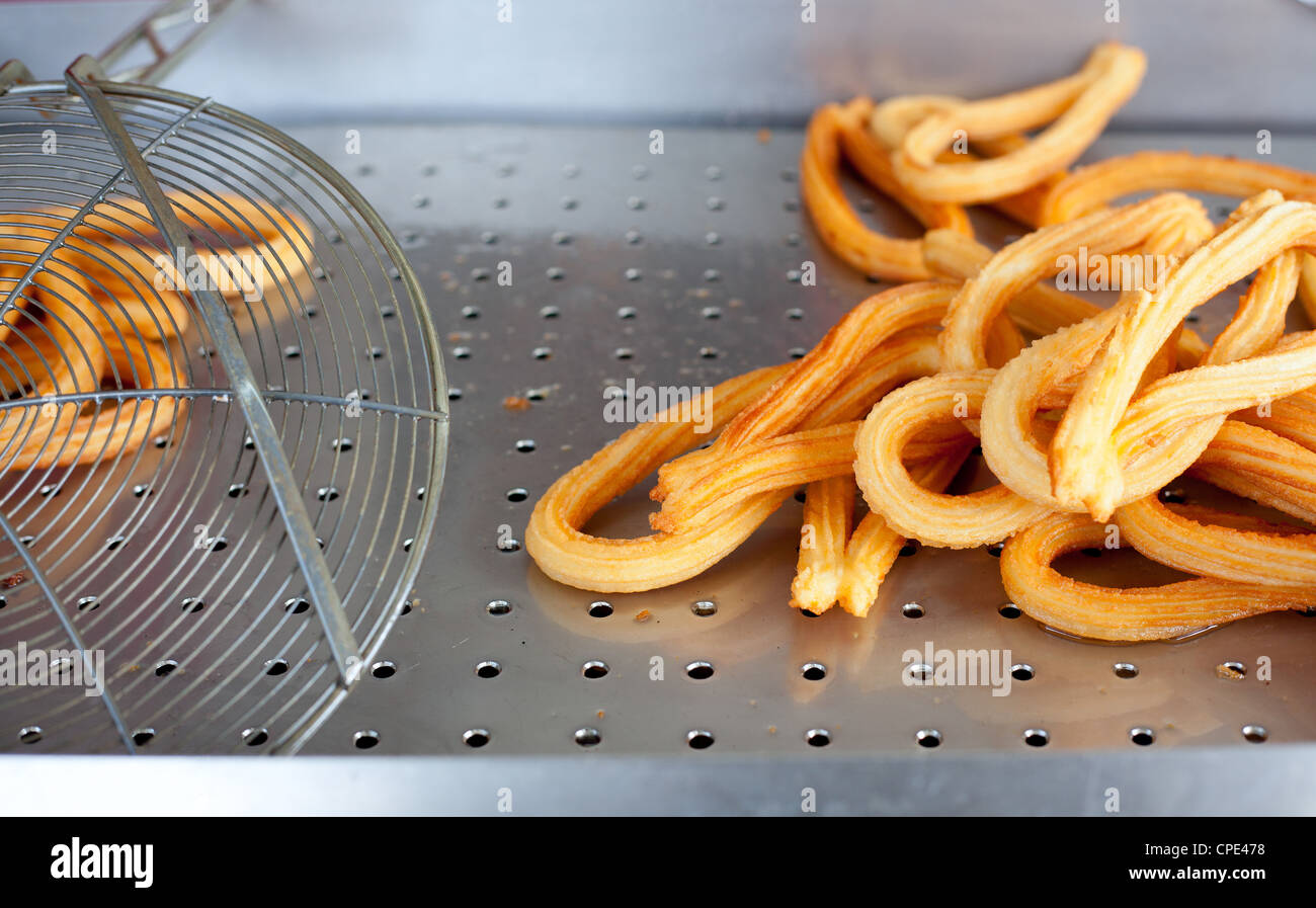 churros fried crullers spanish flour fritters on stainless steel ...