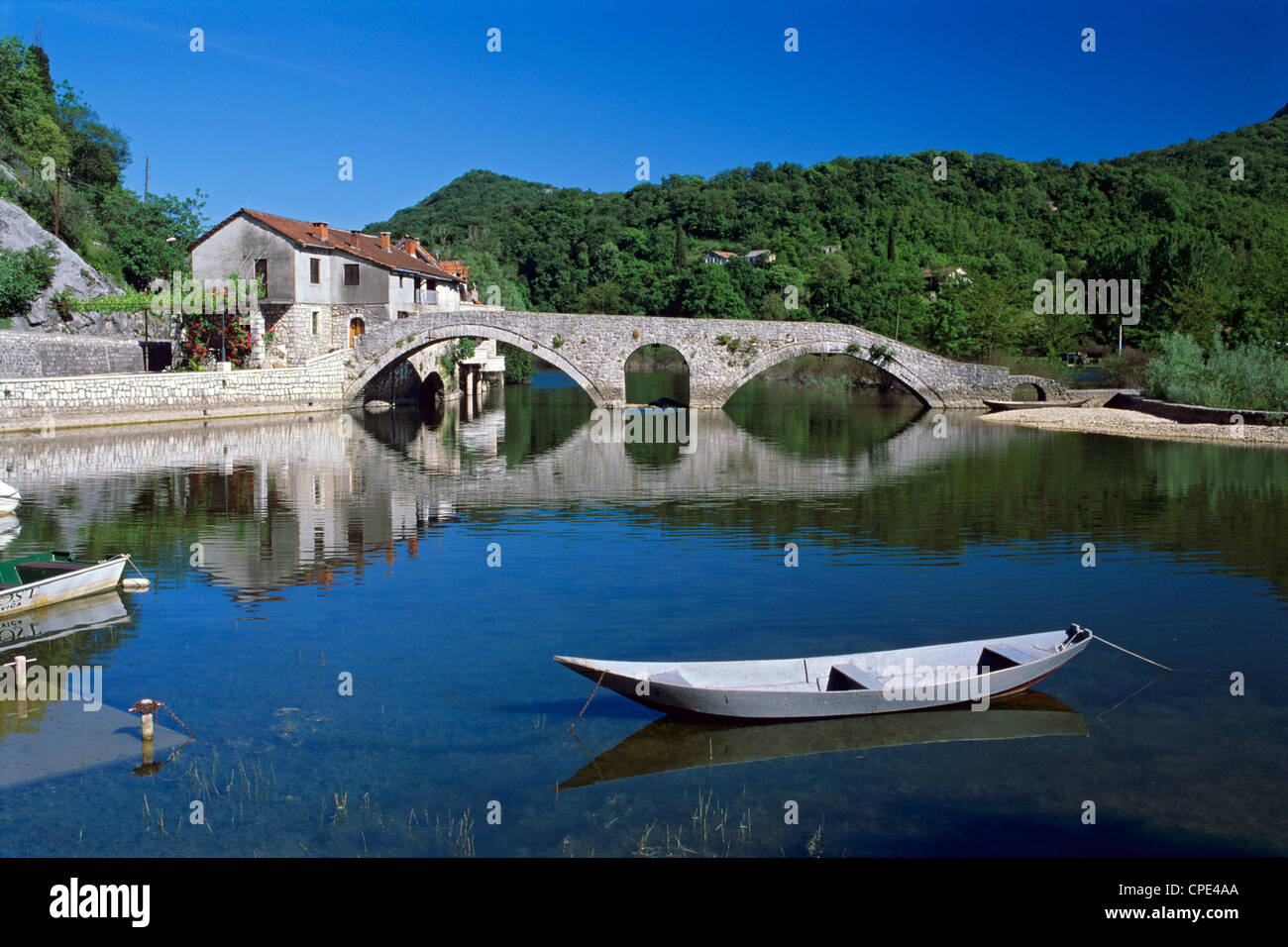 Rijeka Crnojevica river and the ancient triple arched bridge, Rijeka Crnojevica, Montenegro ...