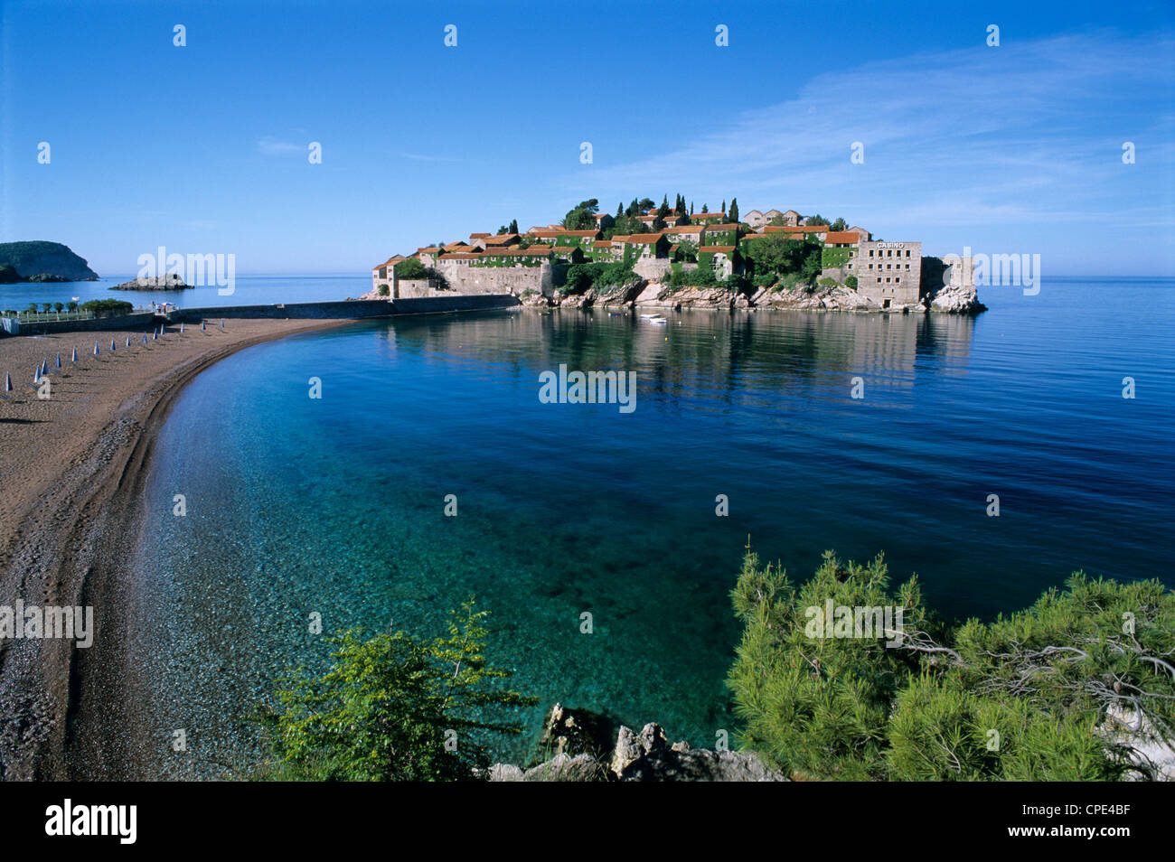 View of island and beach, Sveti Stefan, The Budva Riviera, Montenegro ...