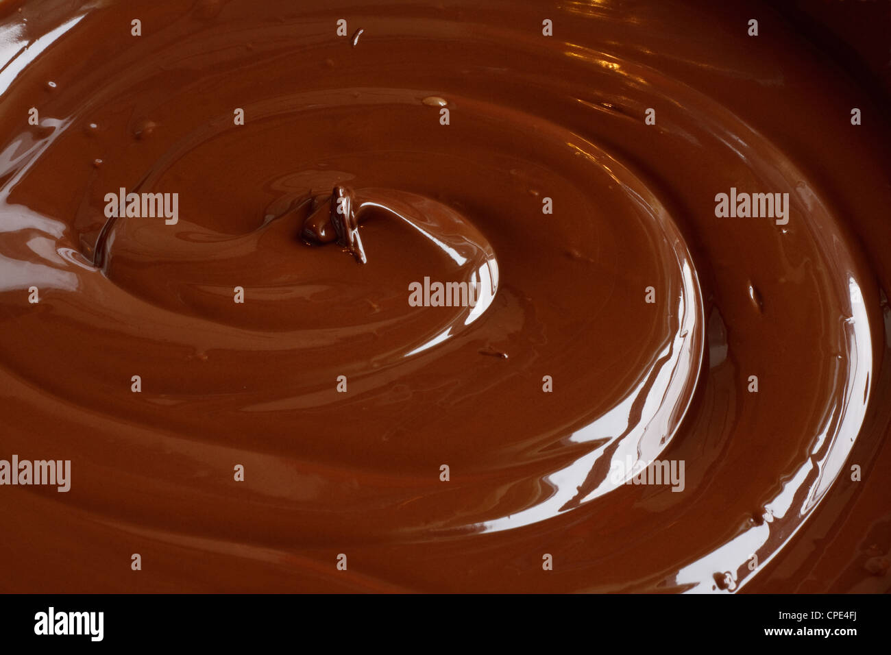 real melted chocolate swirl background Stock Photo - Alamy