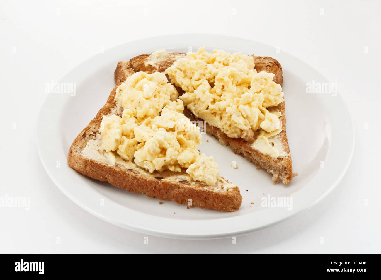 Scrambled eggs on toast triangles Stock Photo - Alamy