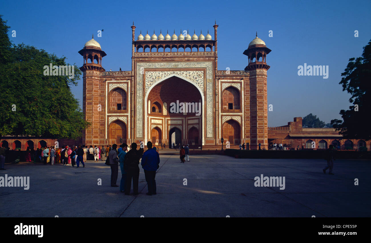Early morning in front of the massive entrance gate to the Taj Mahal ...