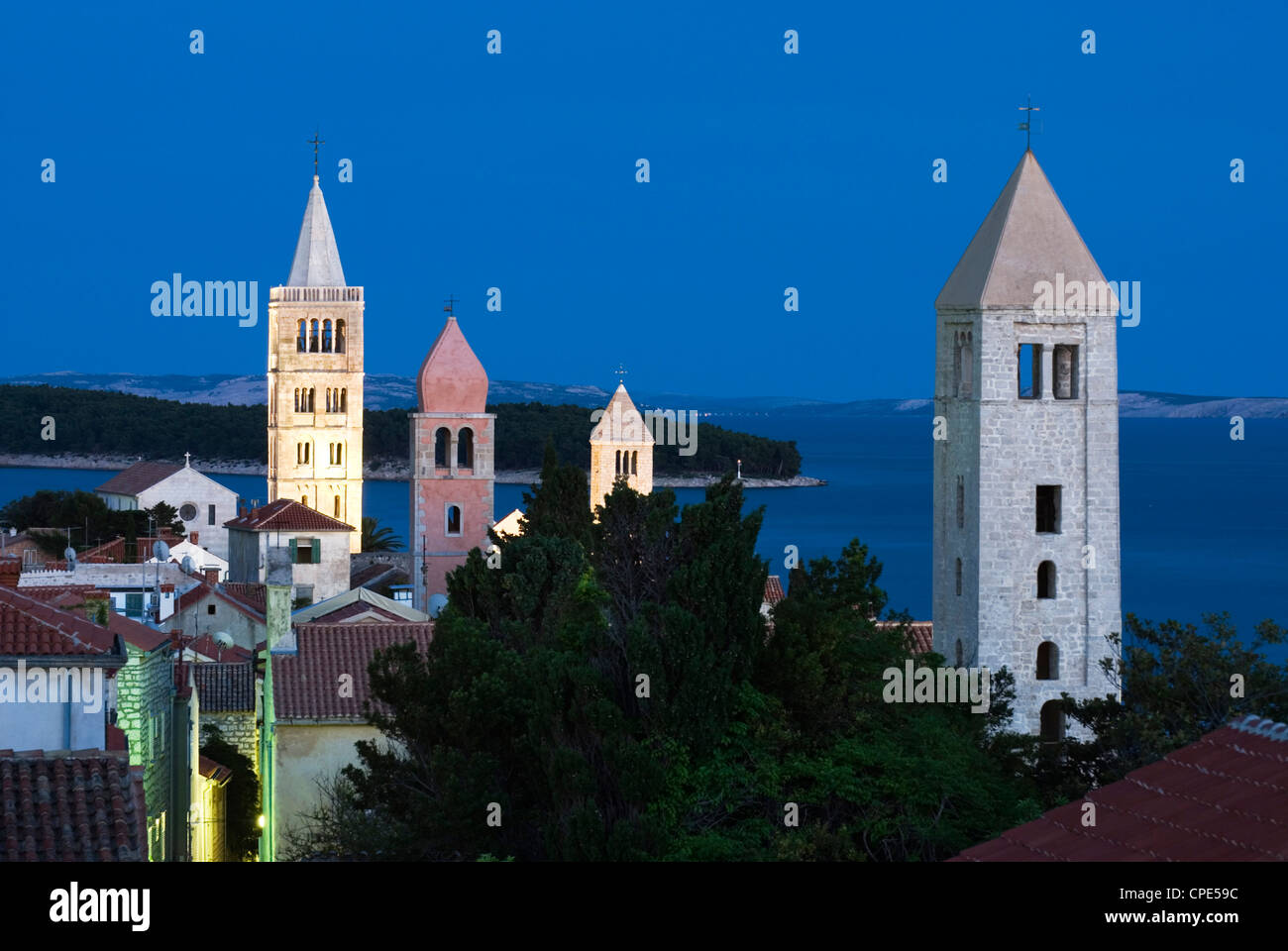 View over campaniles of old town at dusk, Rab Town, Rab Island, Kvarner ...