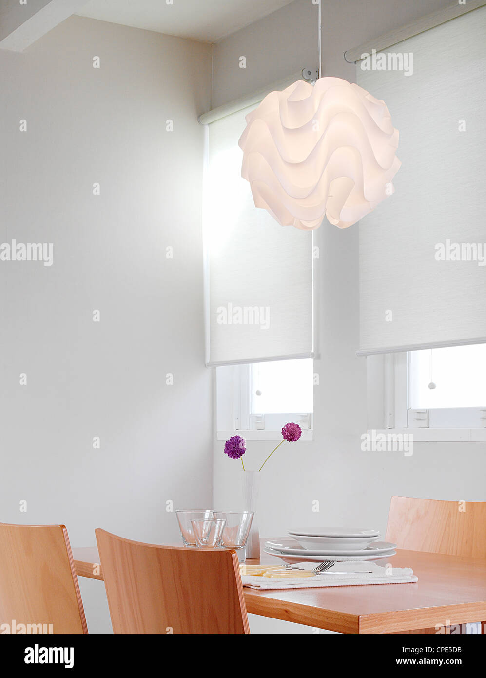 Ceiling Light Hanging Over Dining Table Stock Photo - Alamy