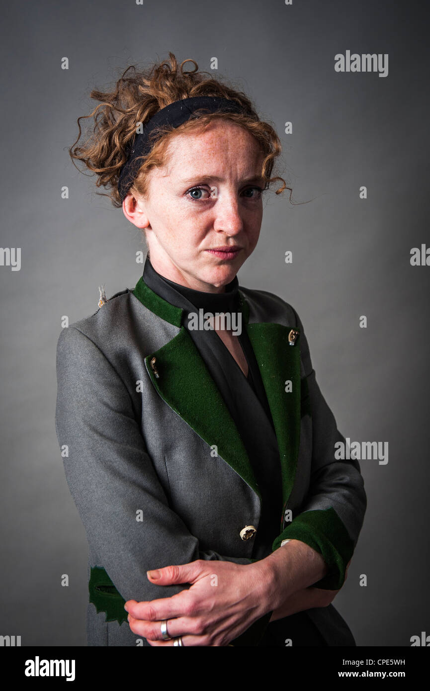 A slim 'alternative' woman wearing a jacket and black headband ...