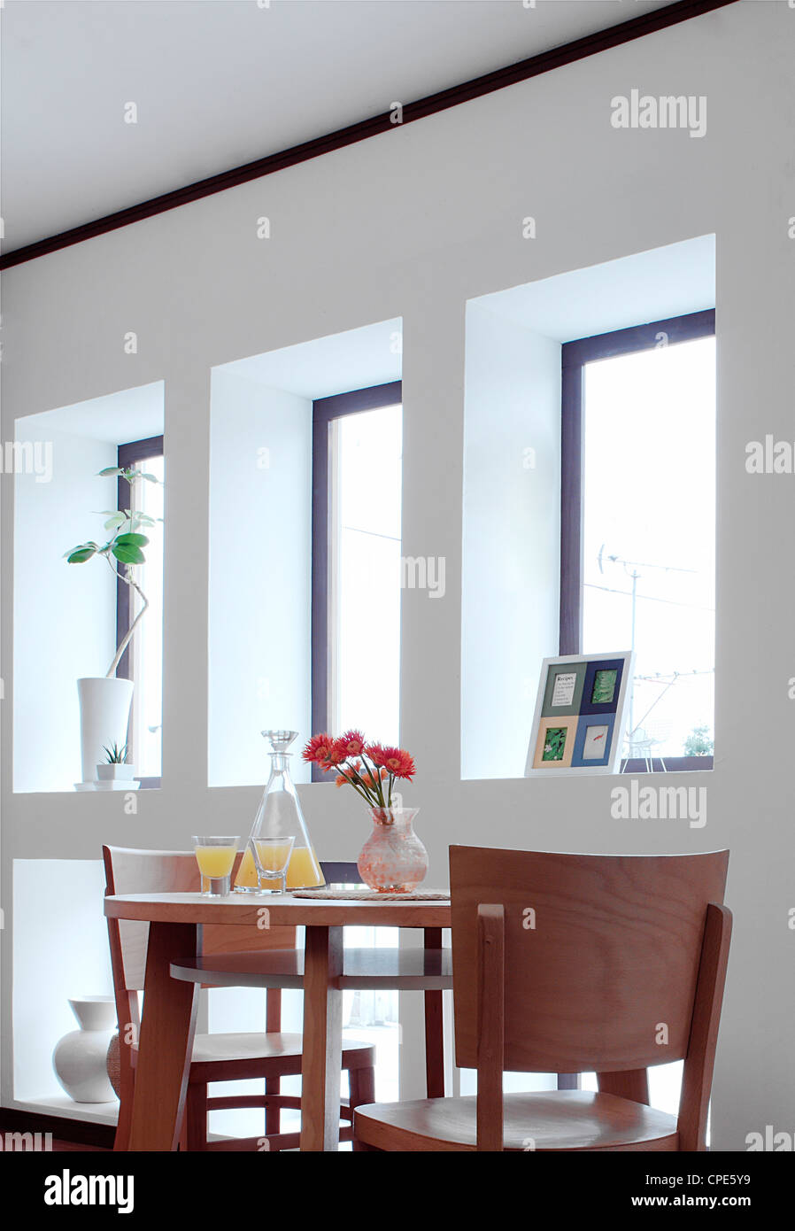 Dining Table With Beverage And Flower Vase Stock Photo - Alamy