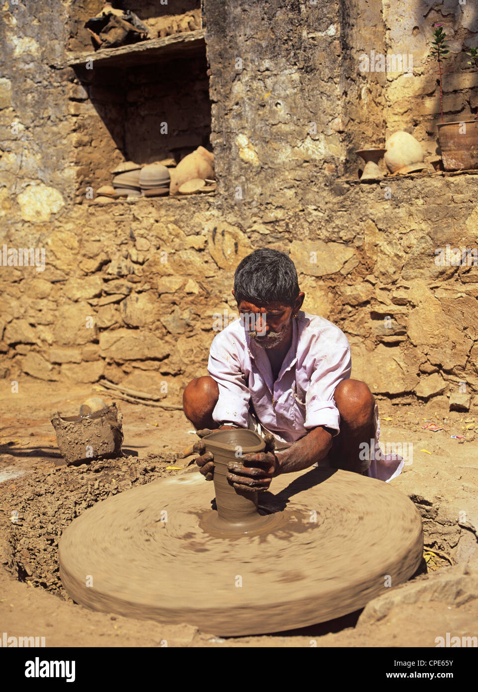Work making water pots hi-res stock photography and images - Alamy