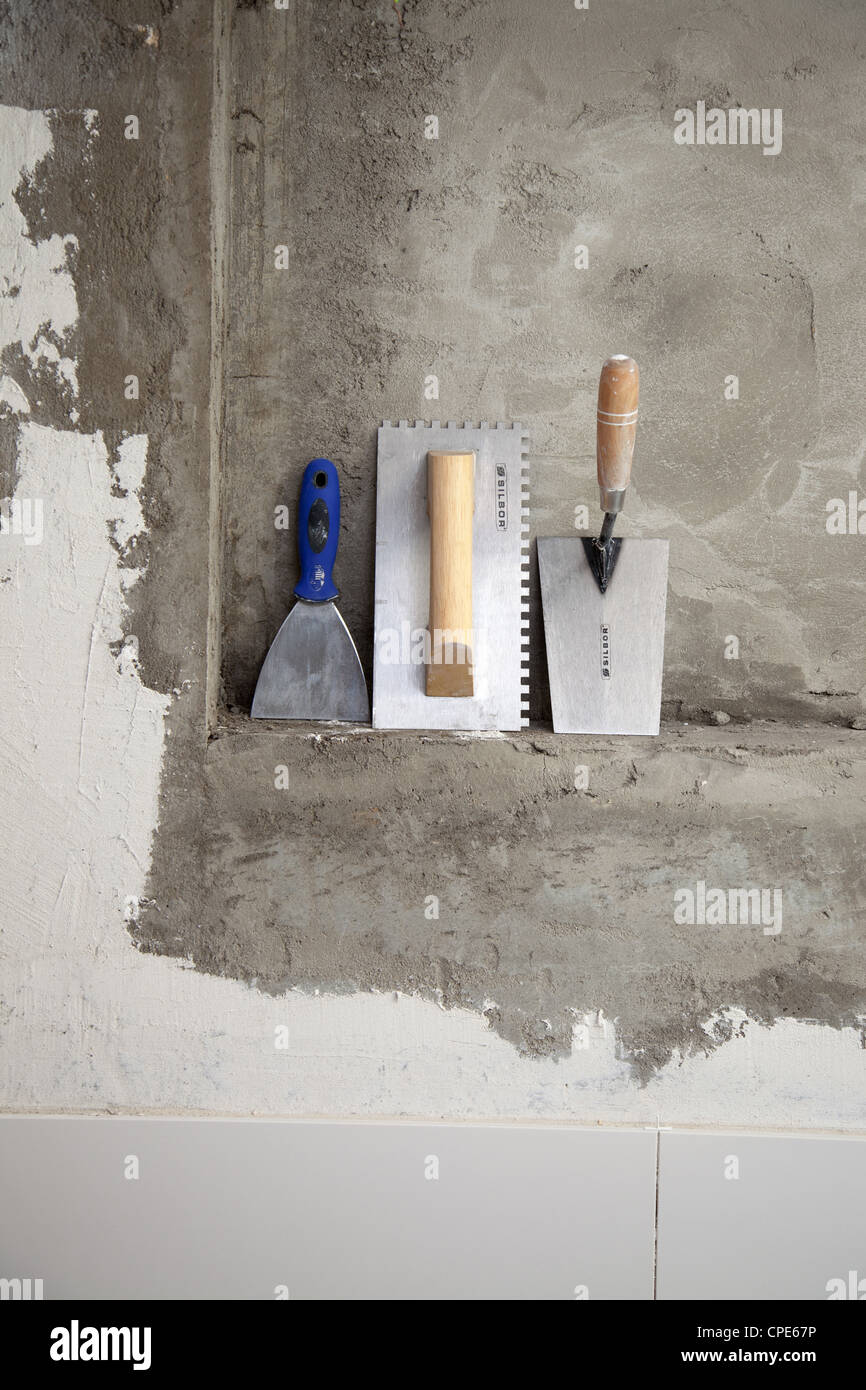 construction stainless steel trowel tools and spatula on cement mortar ...