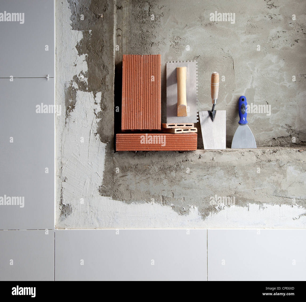 construction stainless steel trowel tools and bricks on cement mortar ...