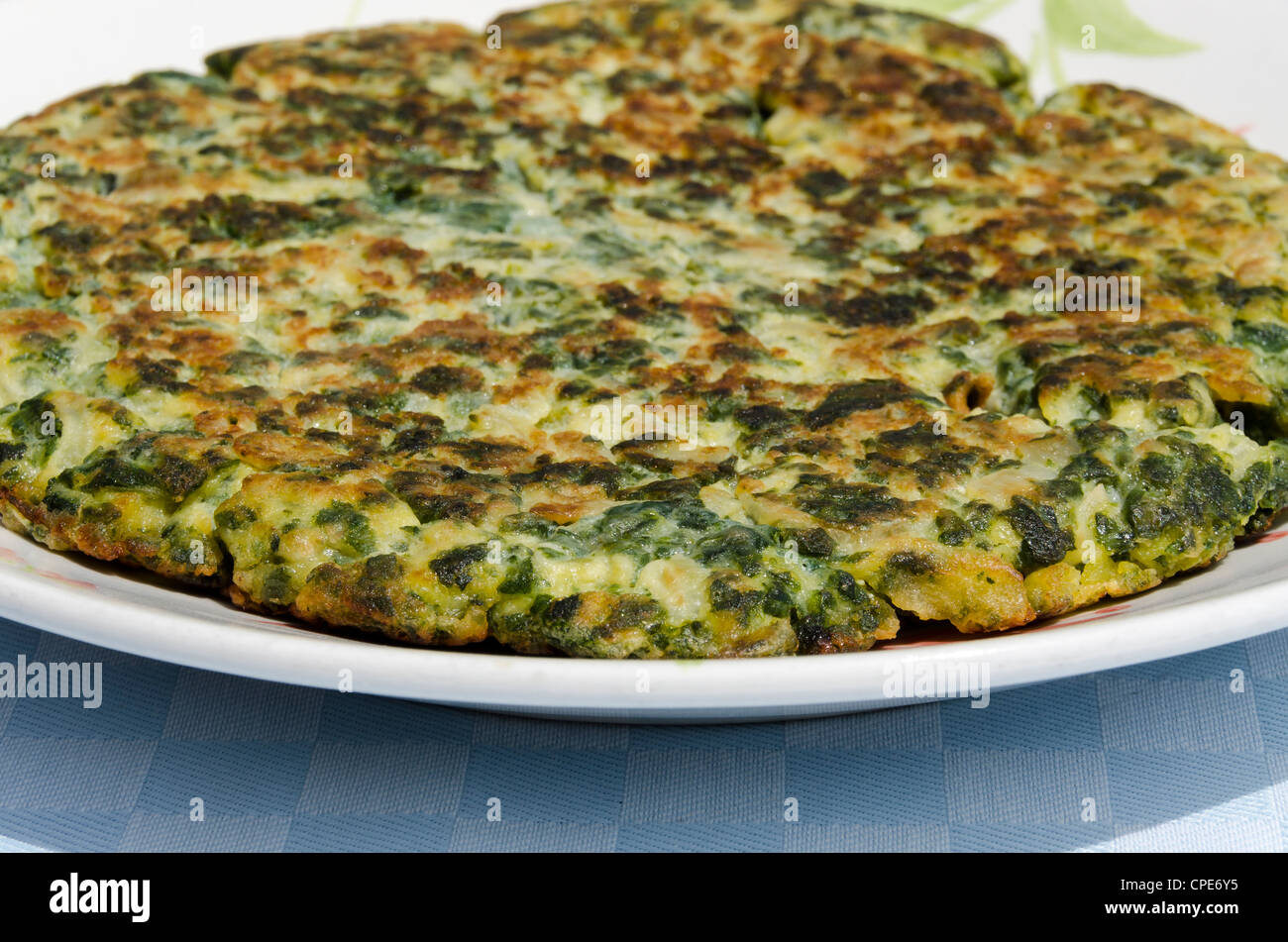 vegetable omelette just baked on white plate Stock Photo - Alamy