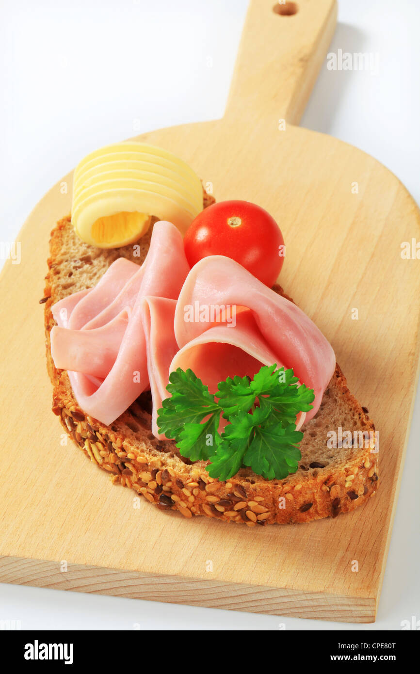 Slice of whole wheat bread with ham Stock Photo - Alamy