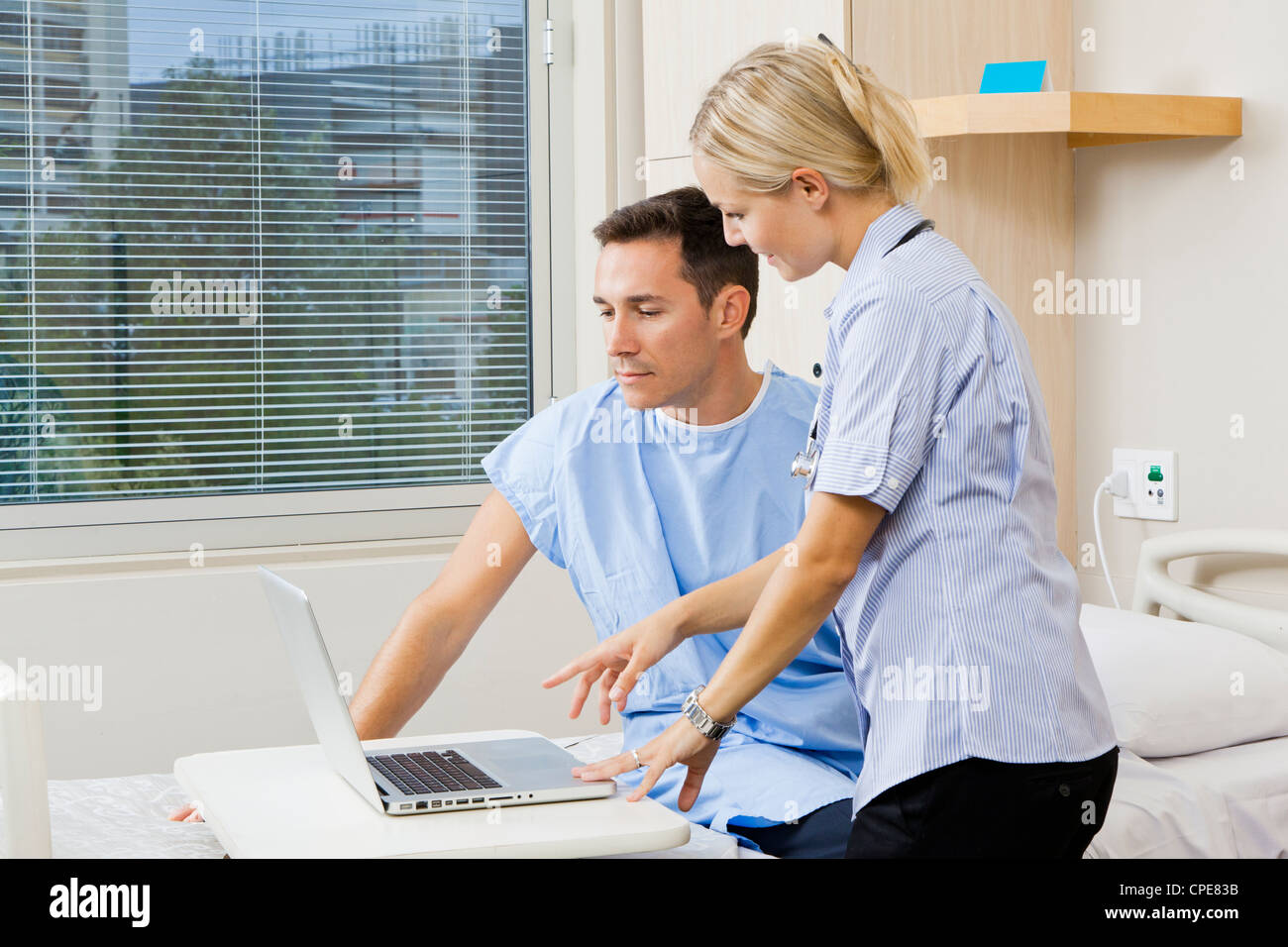 Nurse and patient in hospital ward Stock Photo - Alamy