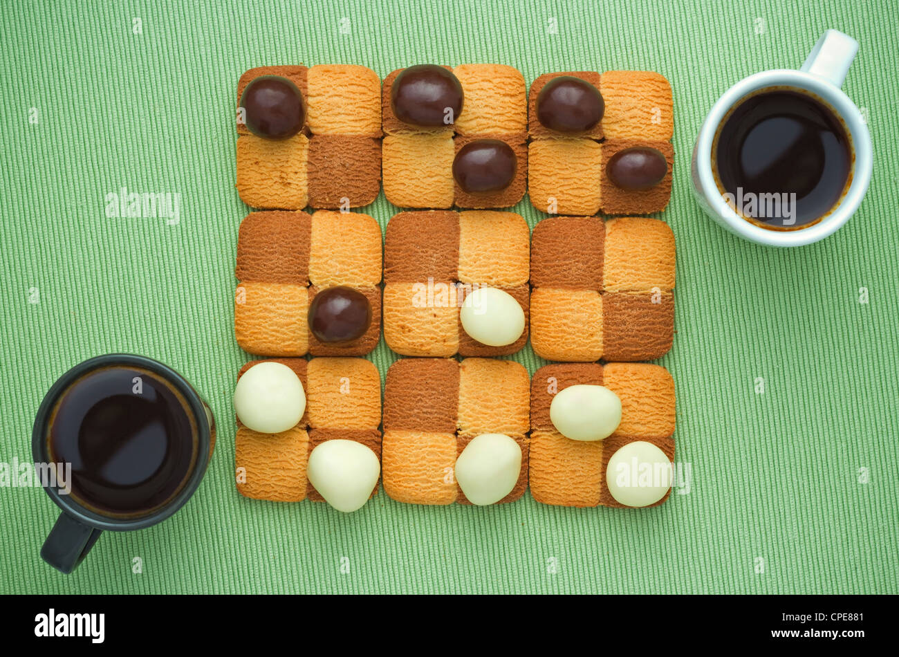 Sweet checkers of biscuits and chocolate drop, two coffee cup Stock ...