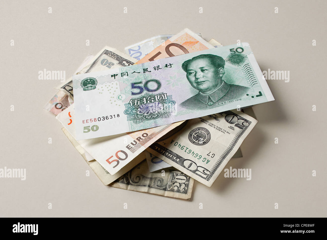 Stack of international banknotes, Yuan, Euro, Dollar Stock Photo - Alamy