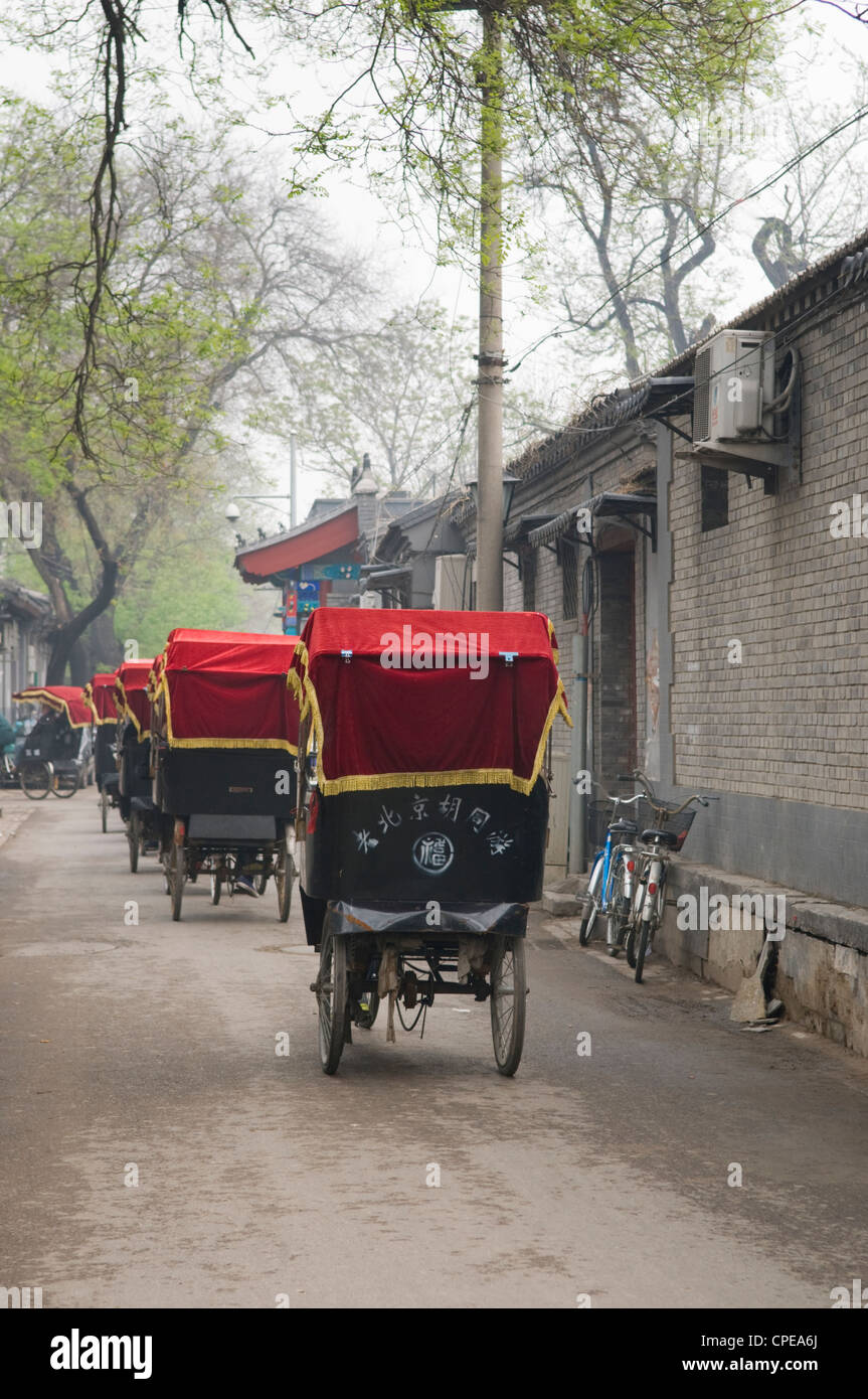 Rickshaw drivers take tourists for Hutong tour, Beijing, China Stock ...