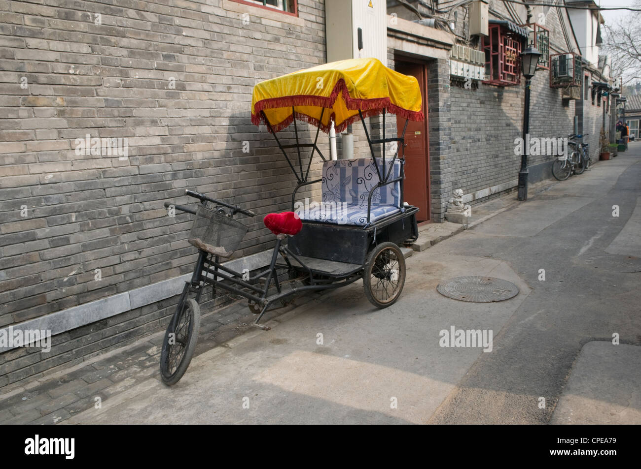 Rickshaw parked in a Hutong, Beijing, China Stock Photo - Alamy