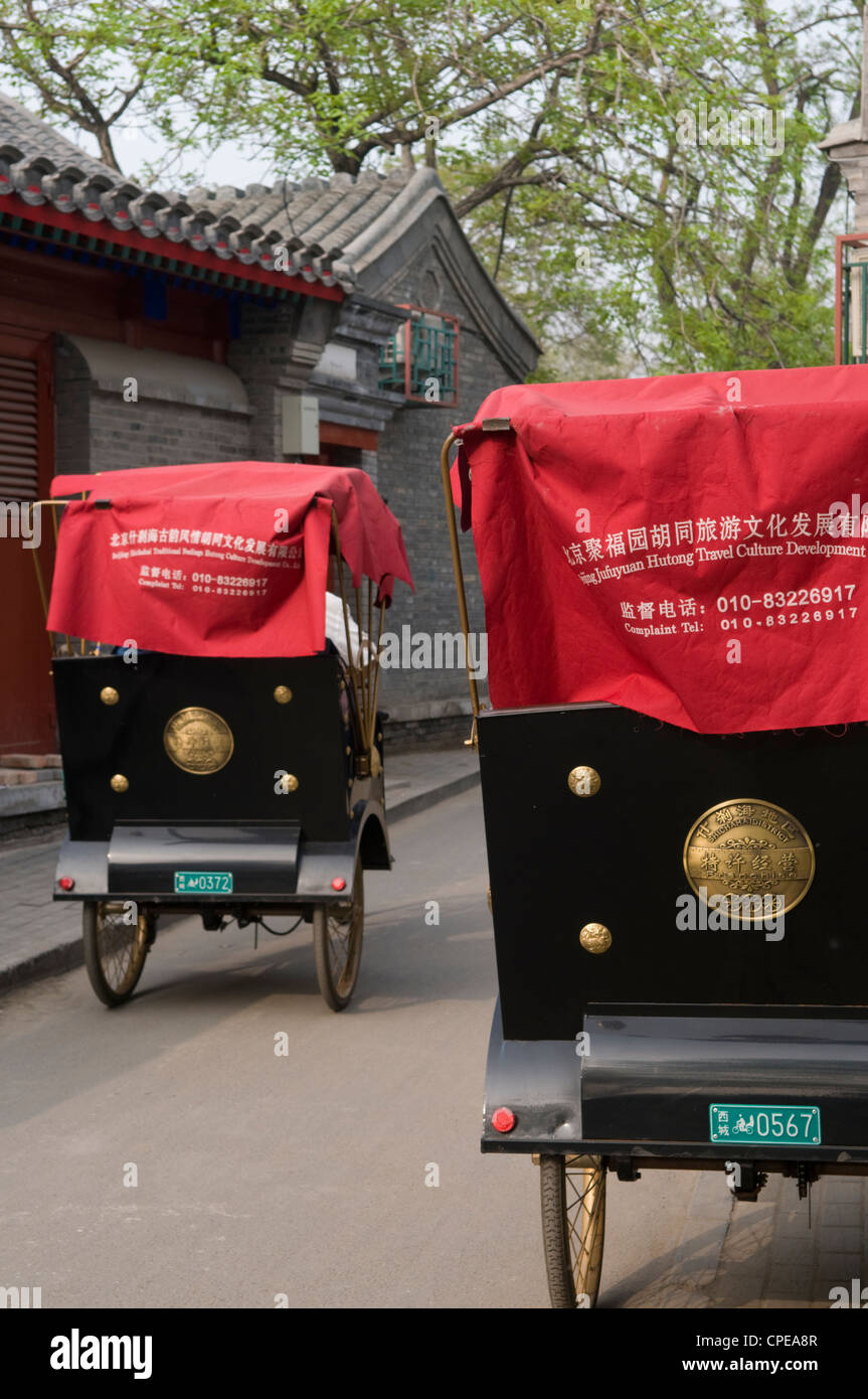 Rickshaw drivers take tourists for Hutong tour, Beijing, China Stock ...