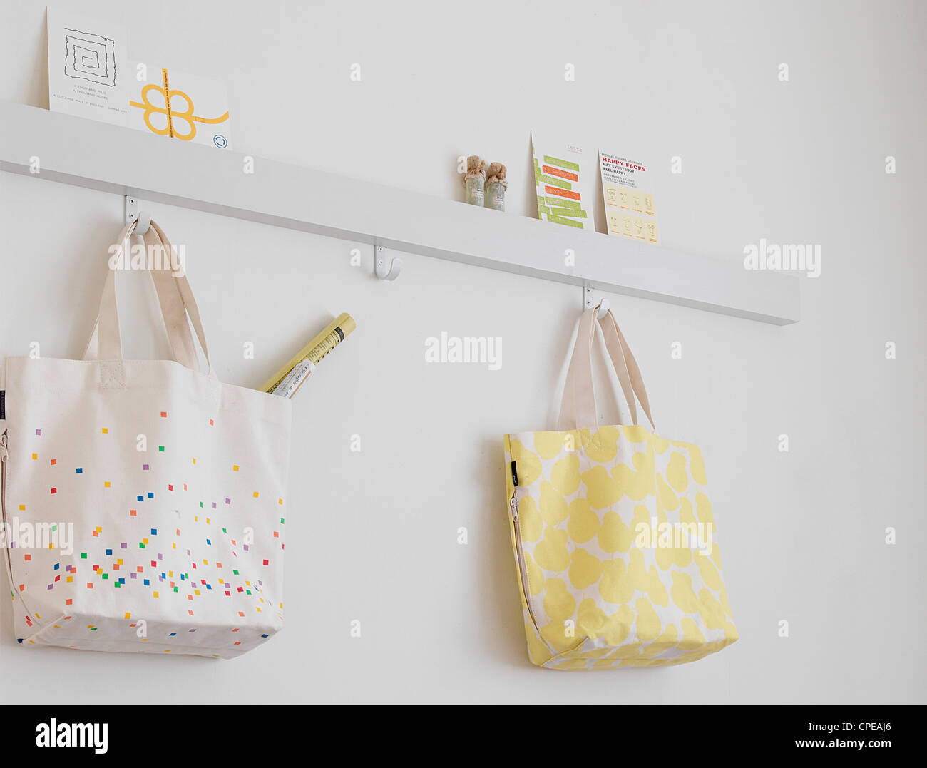 Bags Hanging In Room Stock Photo - Alamy
