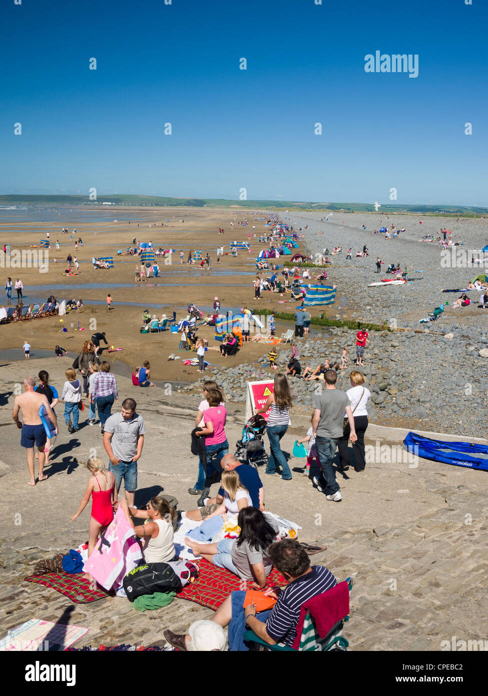 A busy beach on a Bank Holiday at Westward Ho!, Devon, England Stock ...