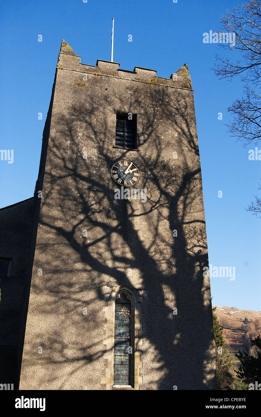 St Oswald's Church Grasmere Cumbria in winter with late afternoon sun ...