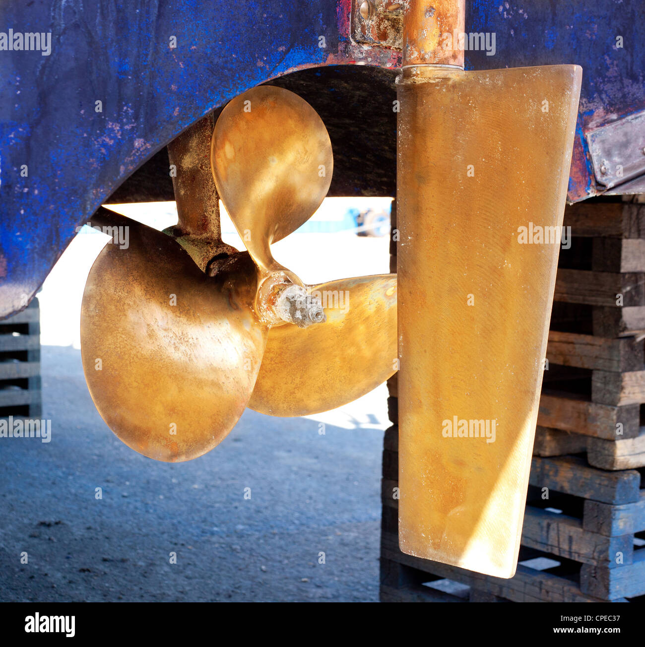 brass boat propeller and steering in beached ship Stock Photo - Alamy