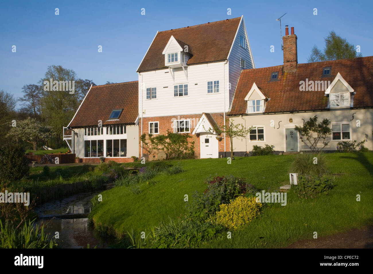 Former watermill converted to a house standing by stream, Shottisham ...