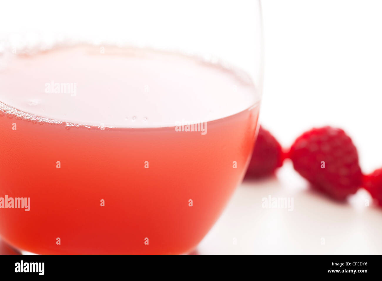 Fresh red fruit juice with raspberries in distance out of focus Stock ...