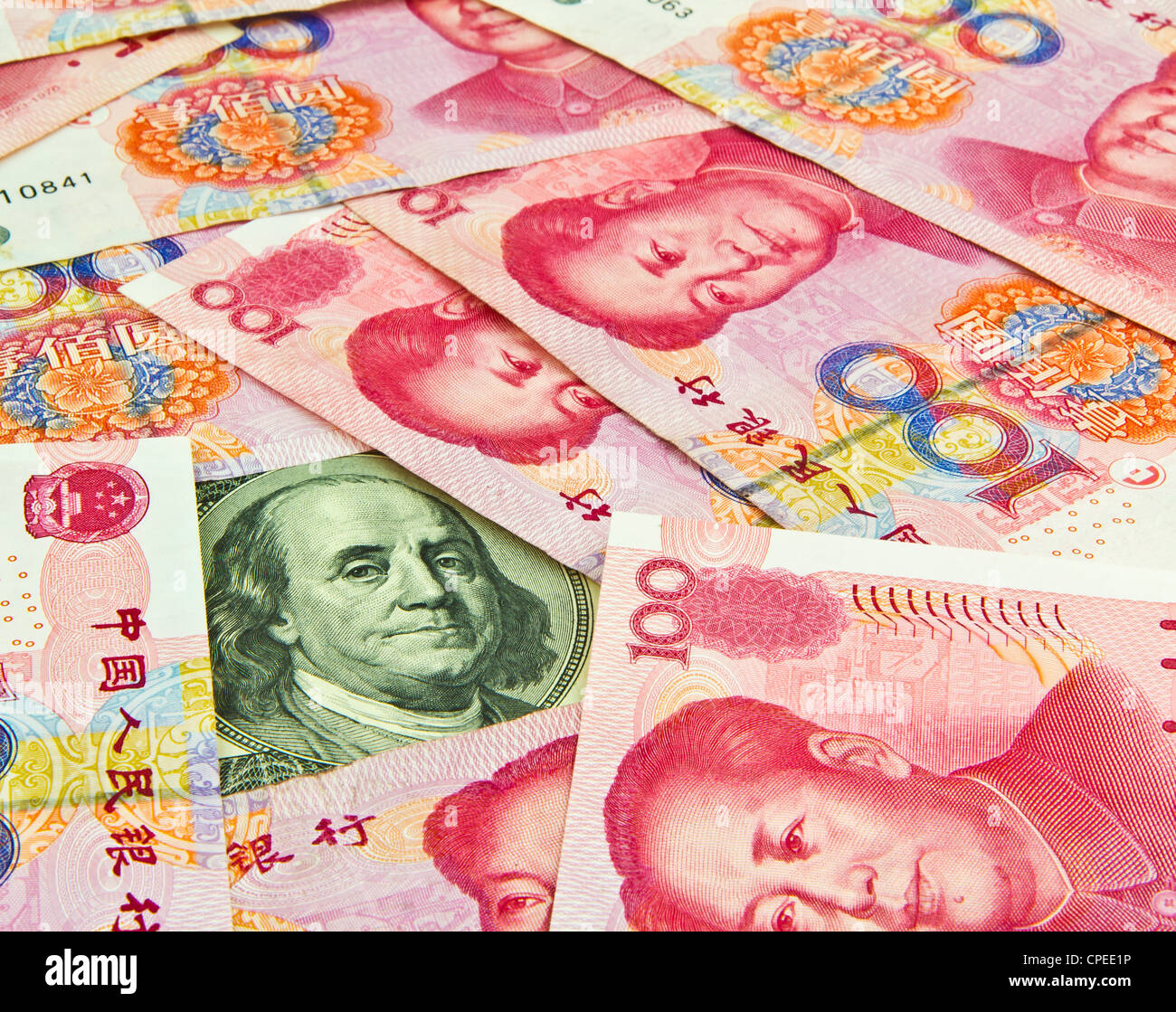 US Hundred dollar bill surrounded by Chinese Yuan Stock Photo - Alamy