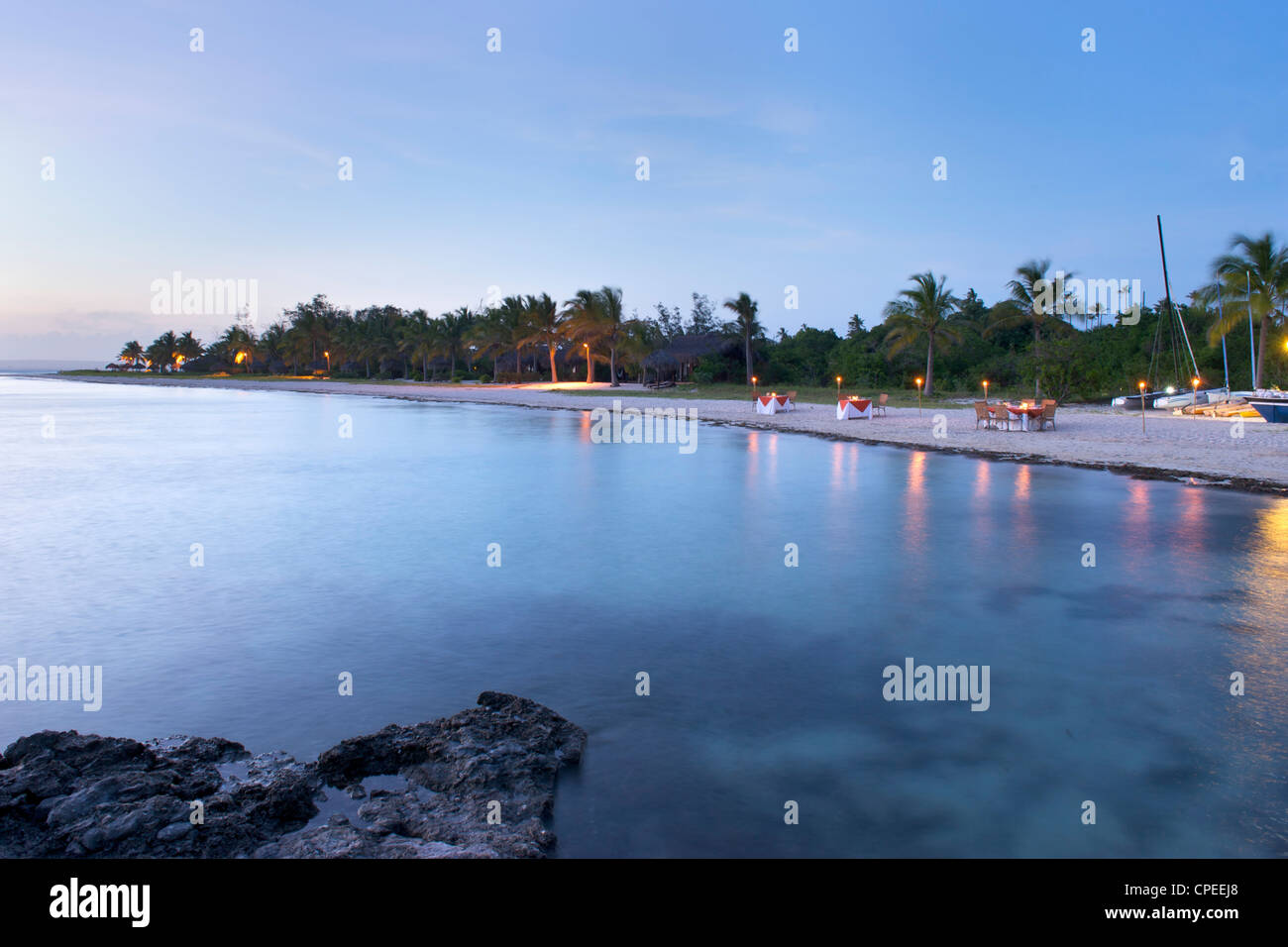 Dinner tables on the beach at Matemo lodge in the Quirimbas archipelago ...